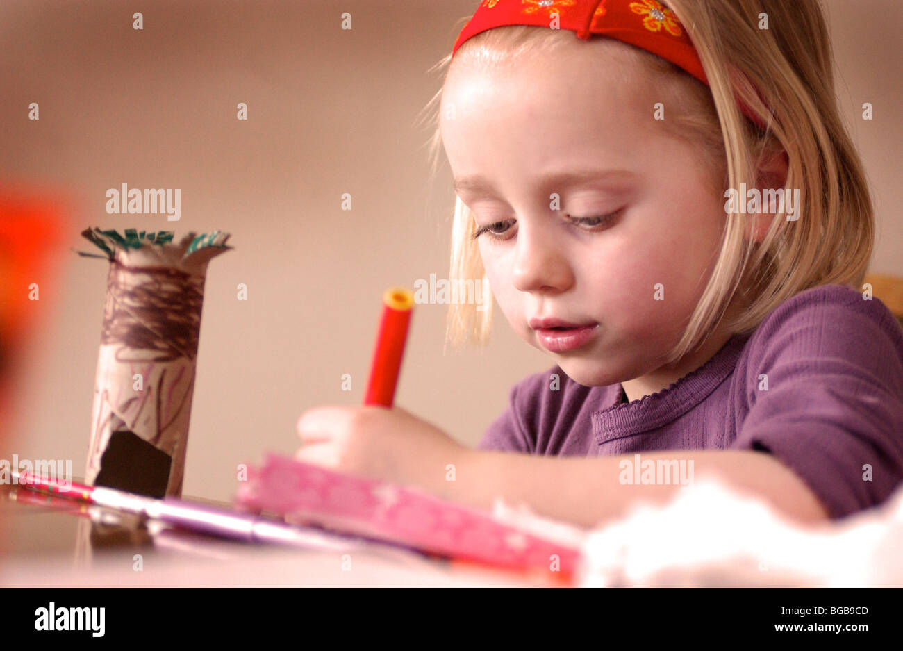 Royalty free photograph of child girl enjoying arts and crafts lesson ...