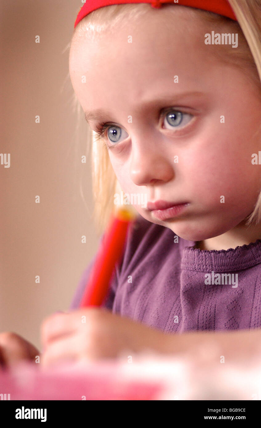 Royalty free photograph of child girl enjoying arts and crafts lesson ...