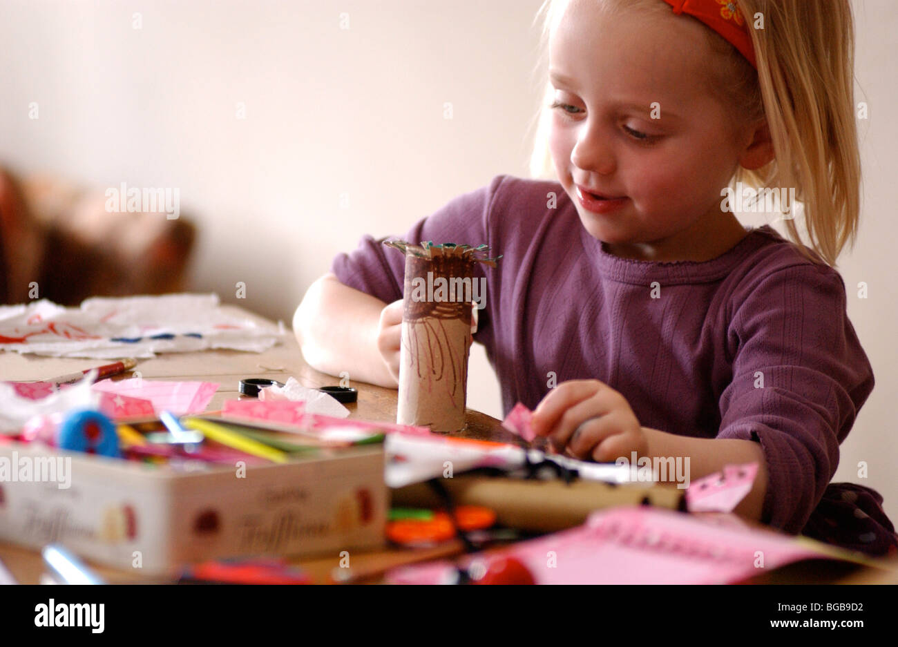Royalty free photograph of child girl enjoying arts and crafts lesson ...