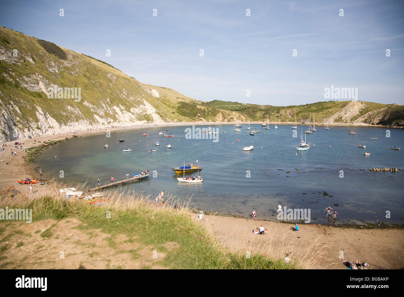 England, Dorset, Lulworth Cove, circular bay and beach scene with ...