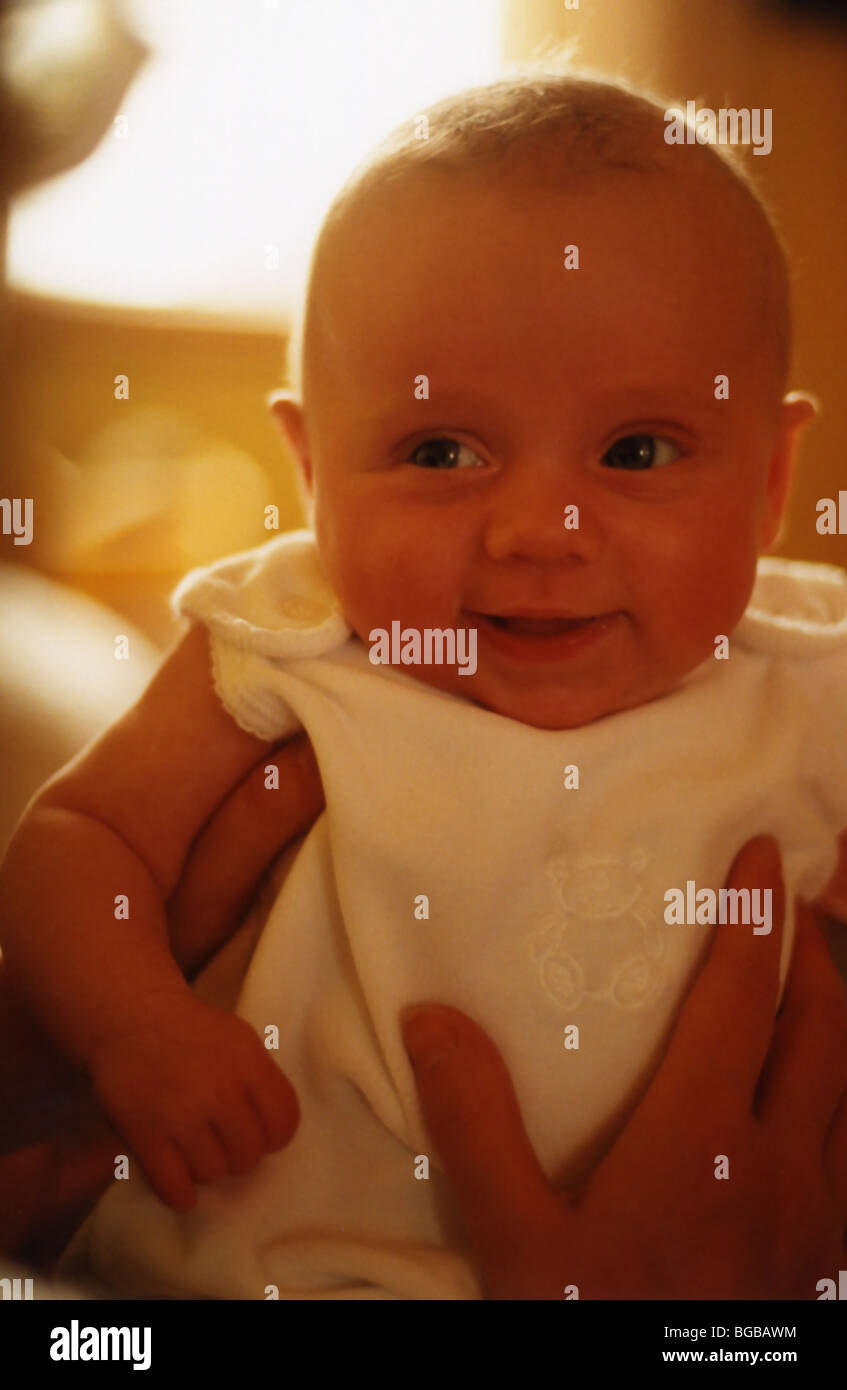 Photograph of baby babies holding smile happy cuddle future girl Stock ...