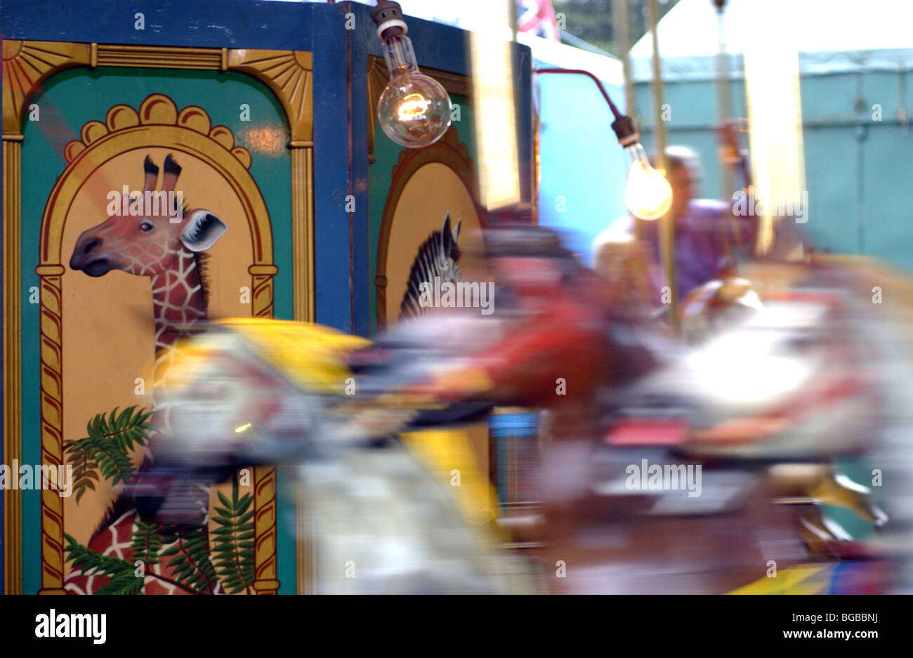Royalty free photograph of a merry go around very fast and blurring at ...