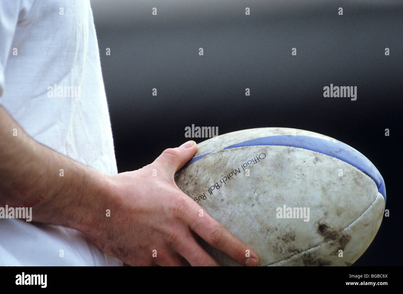 Rugby player holding a ball Stock Photo - Alamy