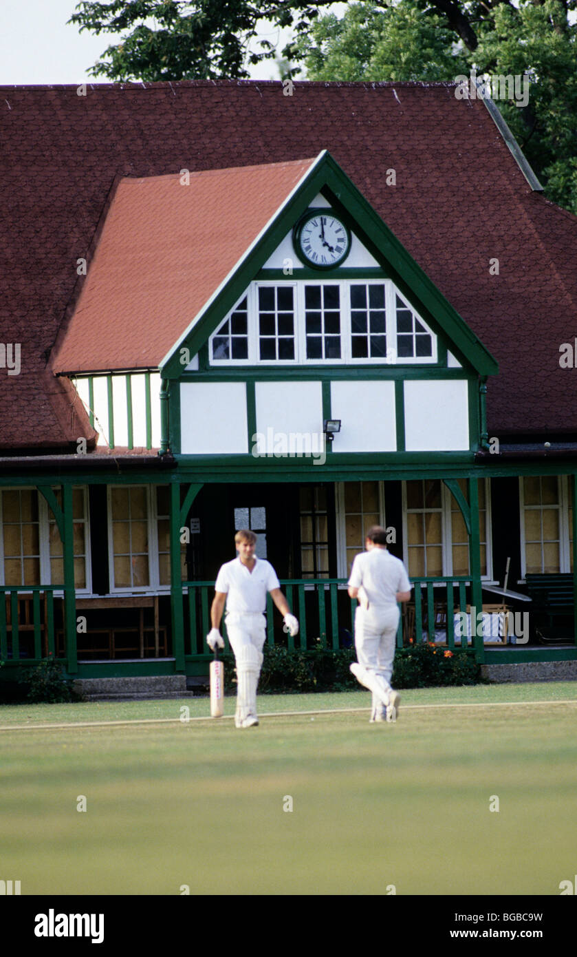 Two cricketers outside the club house Stock Photo - Alamy