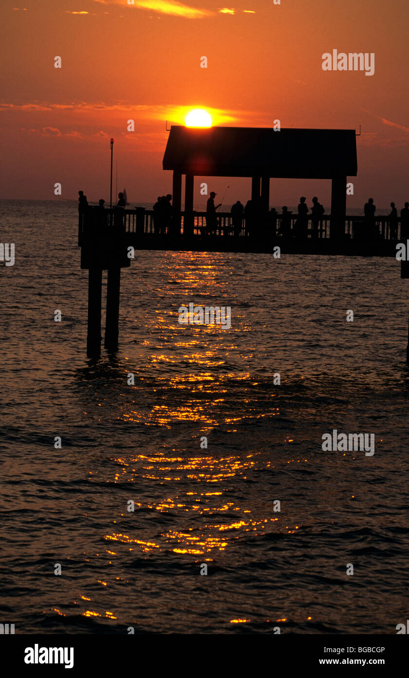 Silhouette of a group pier fishing Stock Photo - Alamy