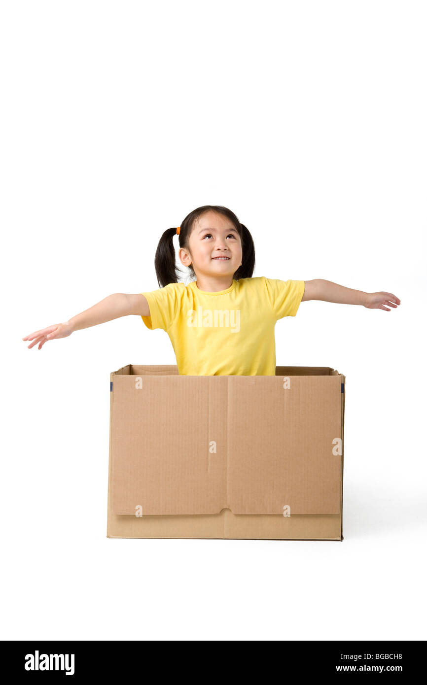 Little girl in a box Stock Photo - Alamy