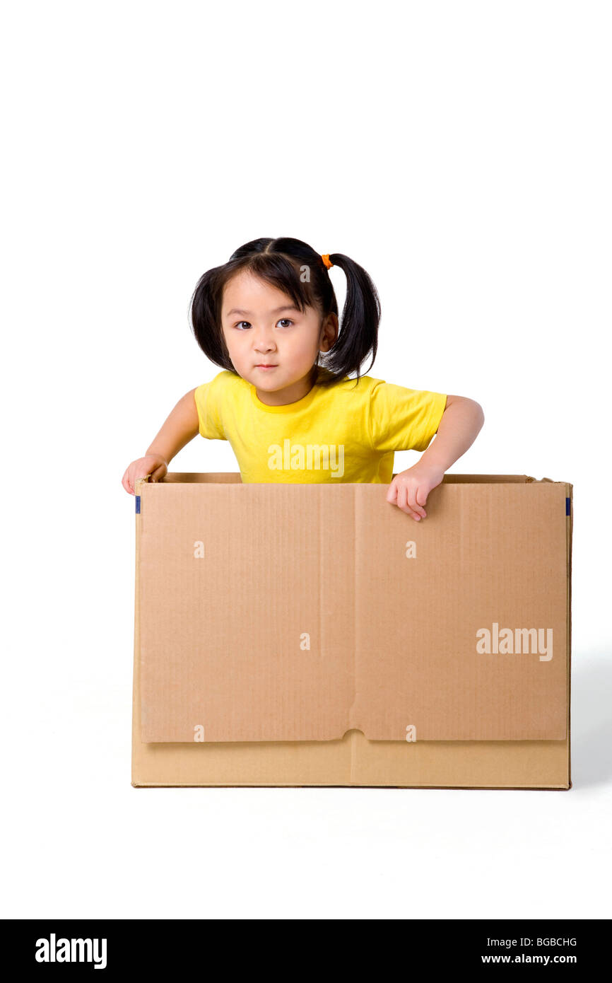 Little girl in a box Stock Photo - Alamy