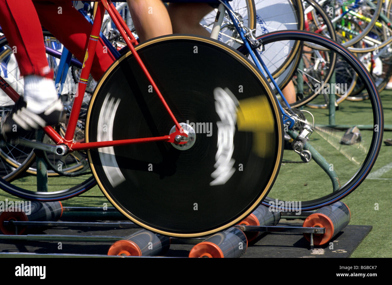 Two bikes on a warm up dynometer Stock Photo - Alamy