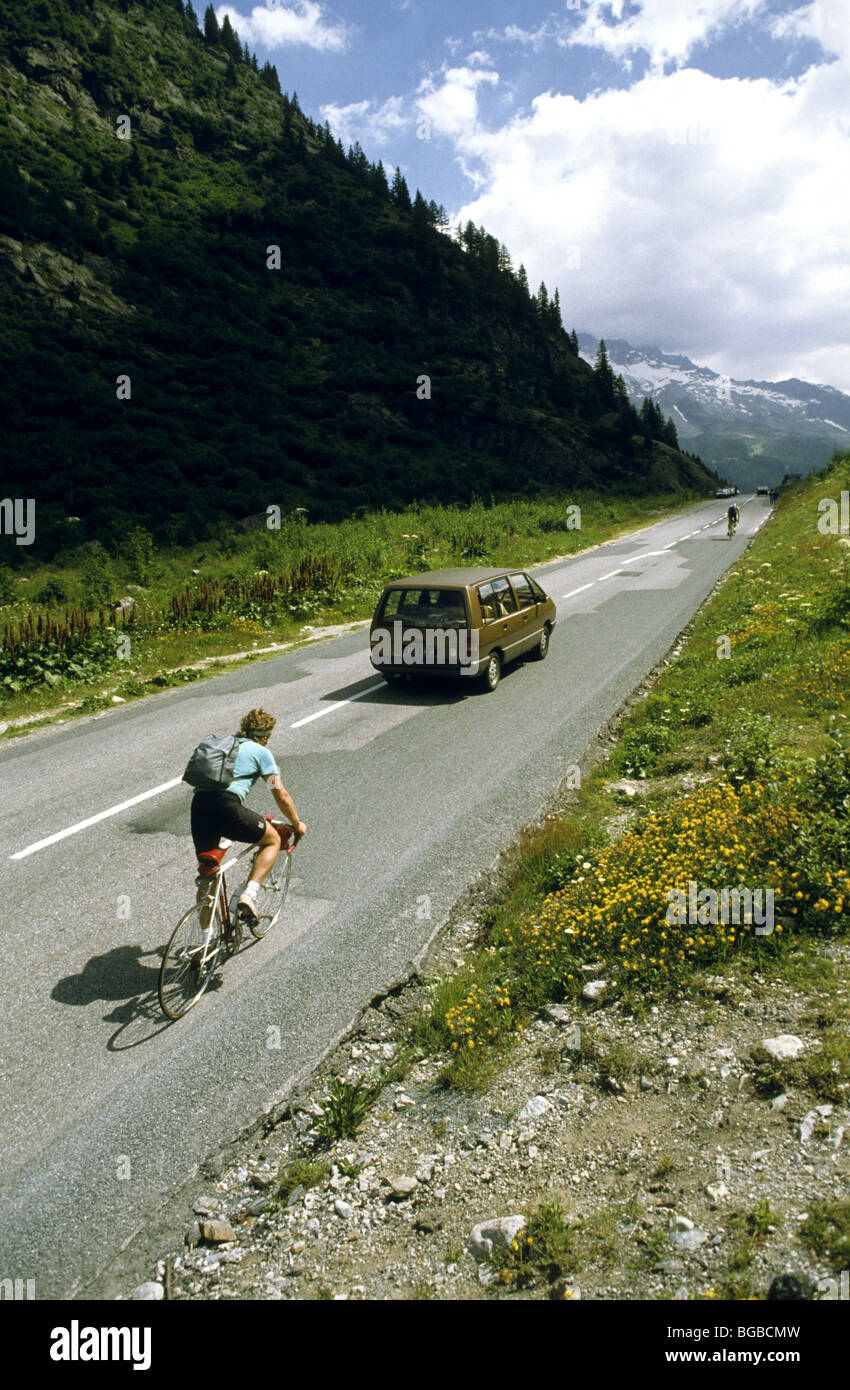 Man riding a bicycle up a mountain side road Stock Photo - Alamy