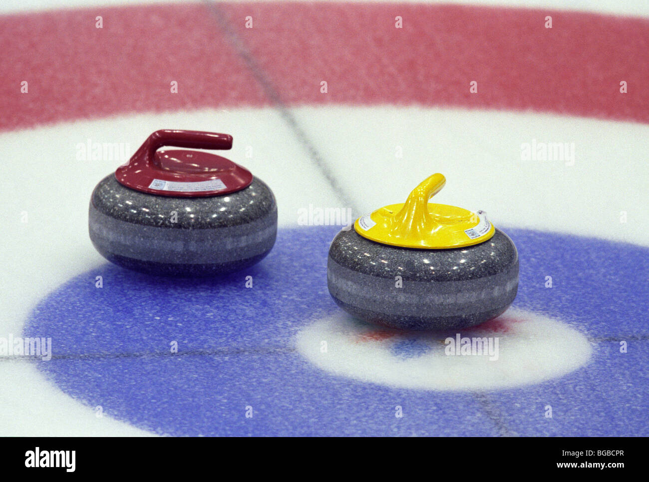 Two curling stones sitting in the house Stock Photo - Alamy