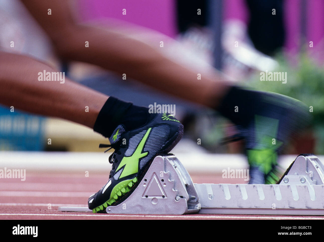 Sprinter taking off from the starting block Stock Photo - Alamy