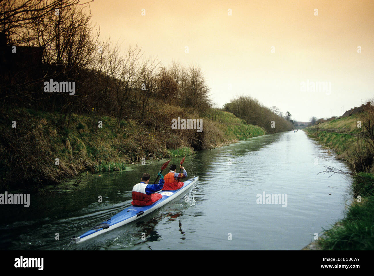 Two men Kayaking on a river Stock Photo - Alamy