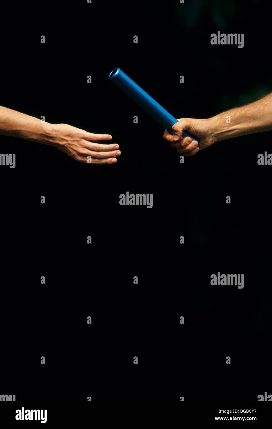 Two athletes passing baton hi-res stock photography and images - Alamy