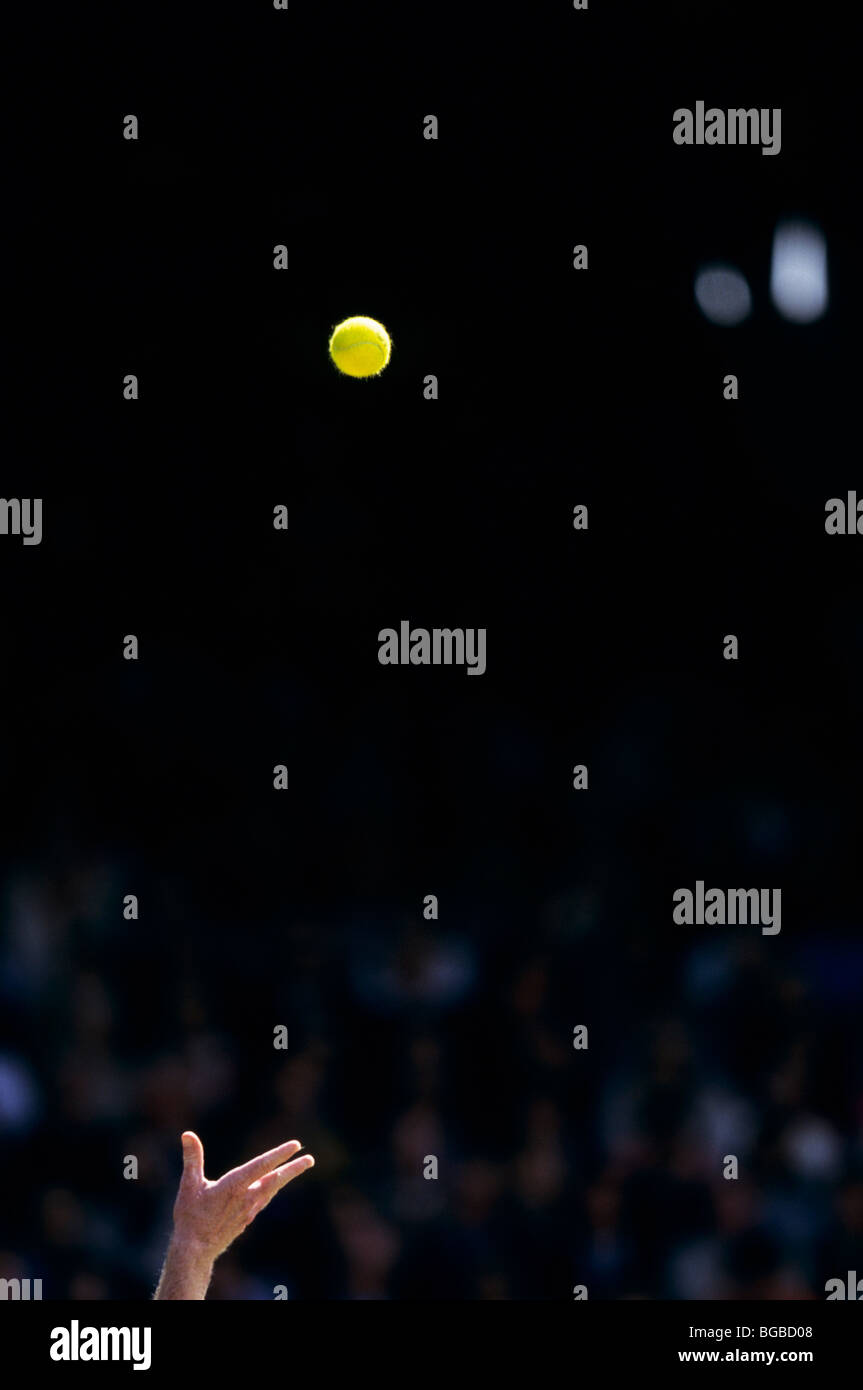 Tennis player serving a ball Stock Photo - Alamy