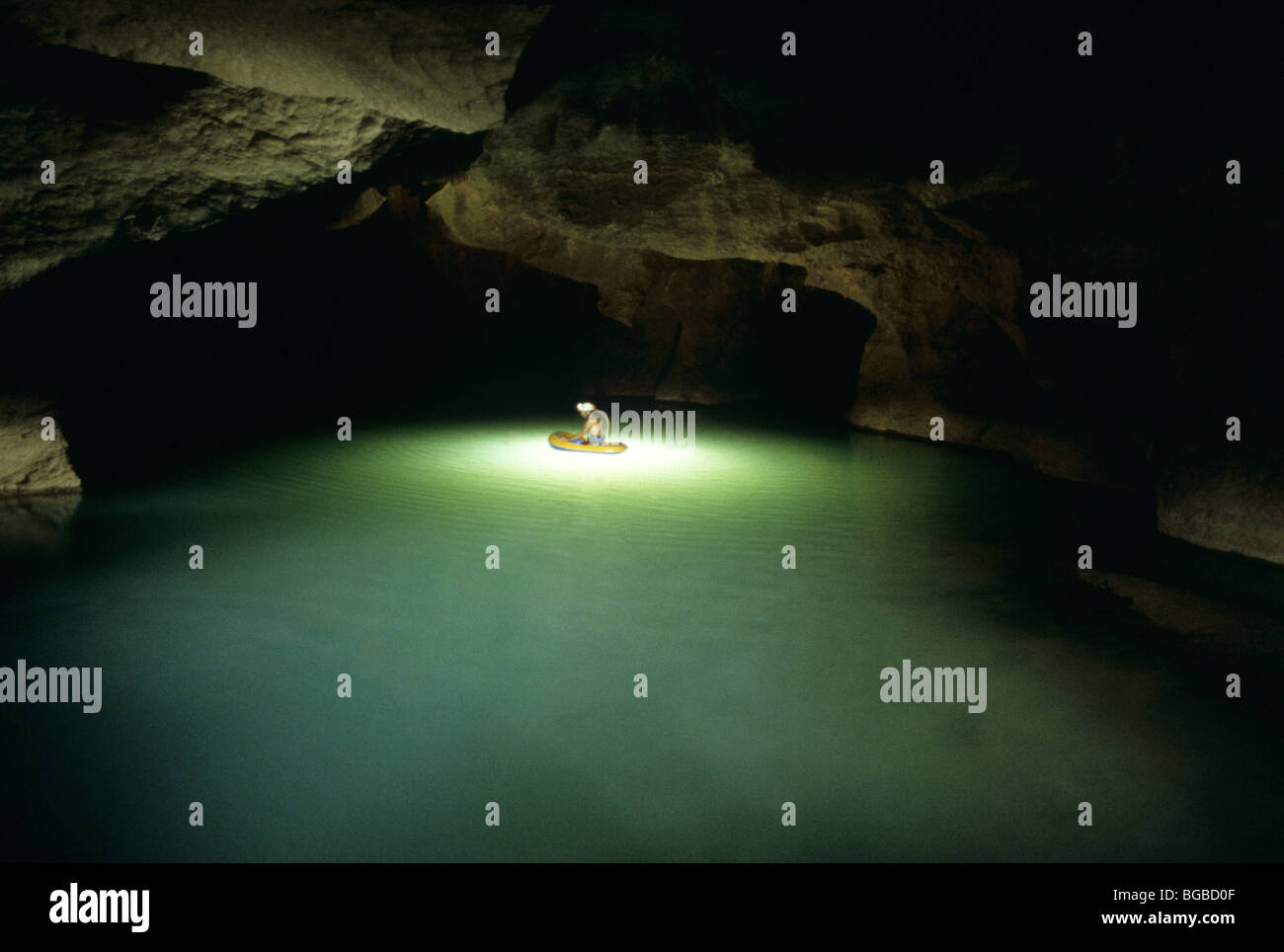 Exploring a water logged cave Stock Photo - Alamy