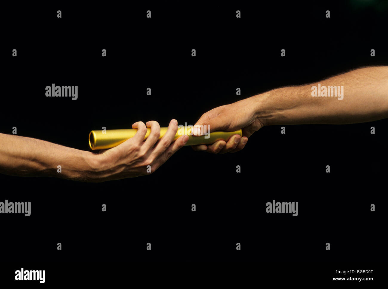 Two athletes passing baton hi-res stock photography and images - Alamy