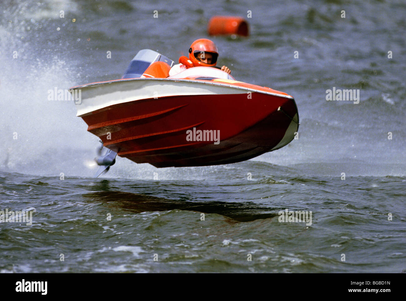 Powerboat driver skimming the waves Stock Photo - Alamy