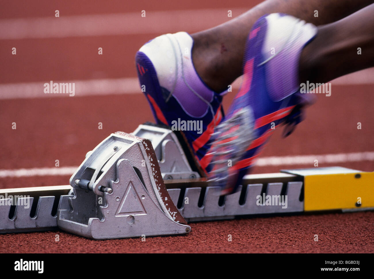 Sprinter leaving the starting block Stock Photo - Alamy