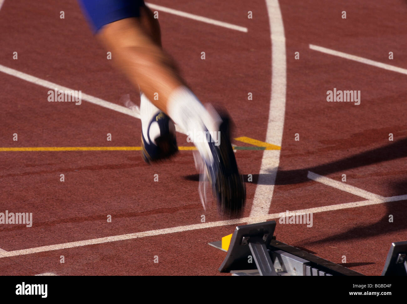 Sprinter leaving the starting block Stock Photo - Alamy