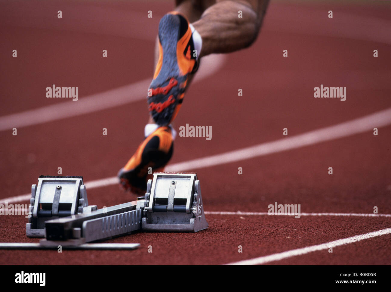 Sprinter leaving the starting block Stock Photo - Alamy