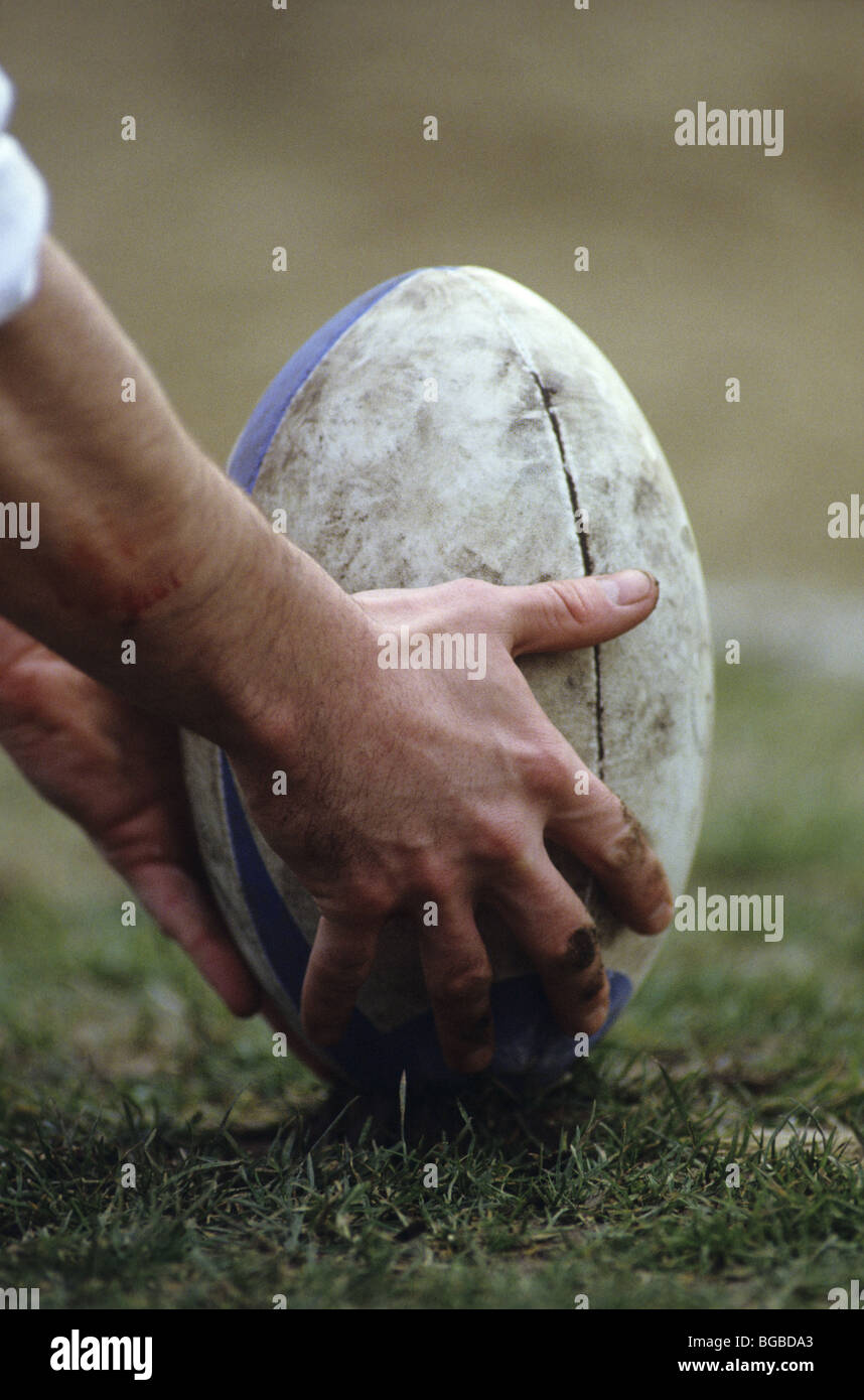 Rugby player placing the ball for a kick Stock Photo - Alamy