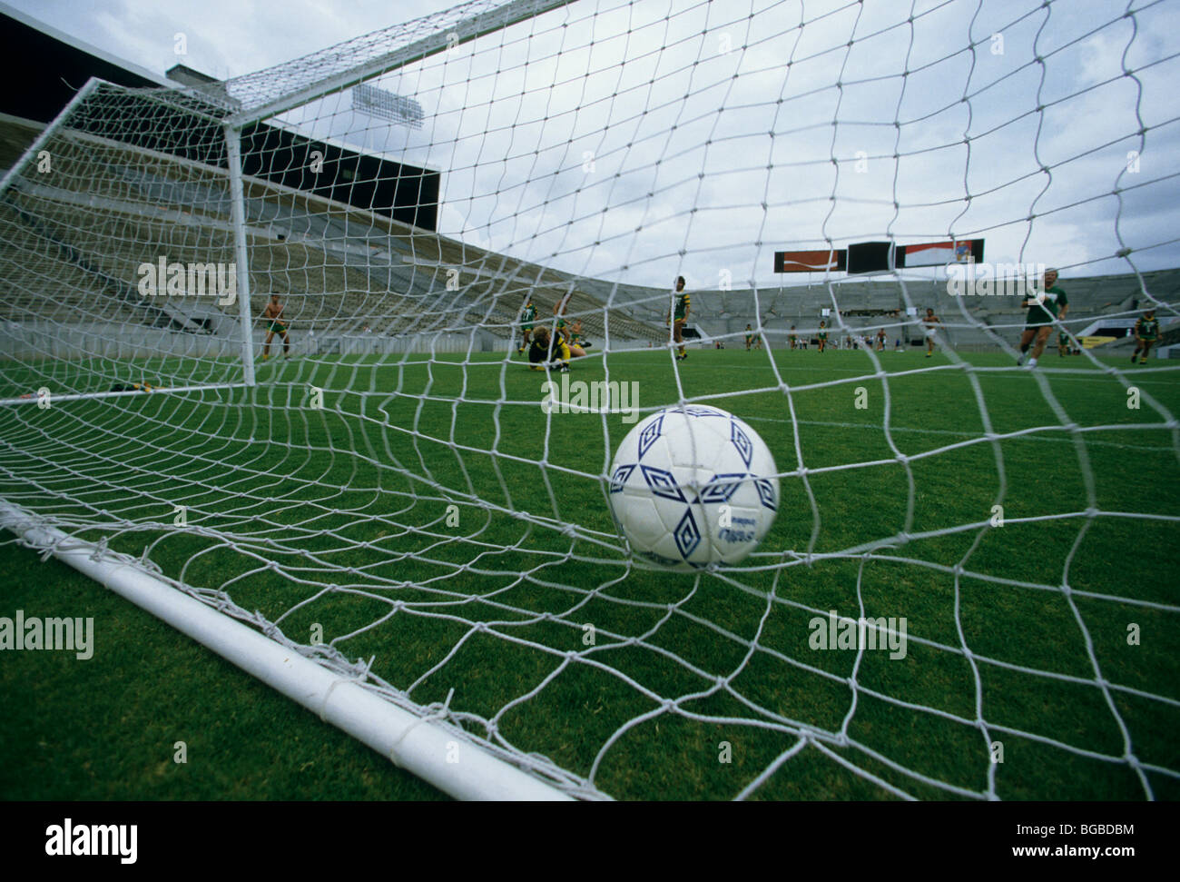 Football in the back of the net Stock Photo - Alamy