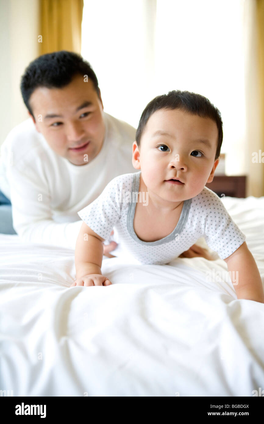 Man with infant Stock Photo - Alamy