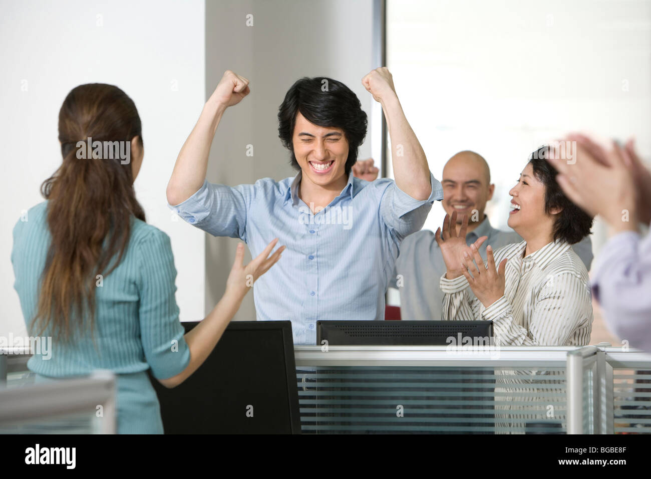 Office workers celebrate a success Stock Photo - Alamy