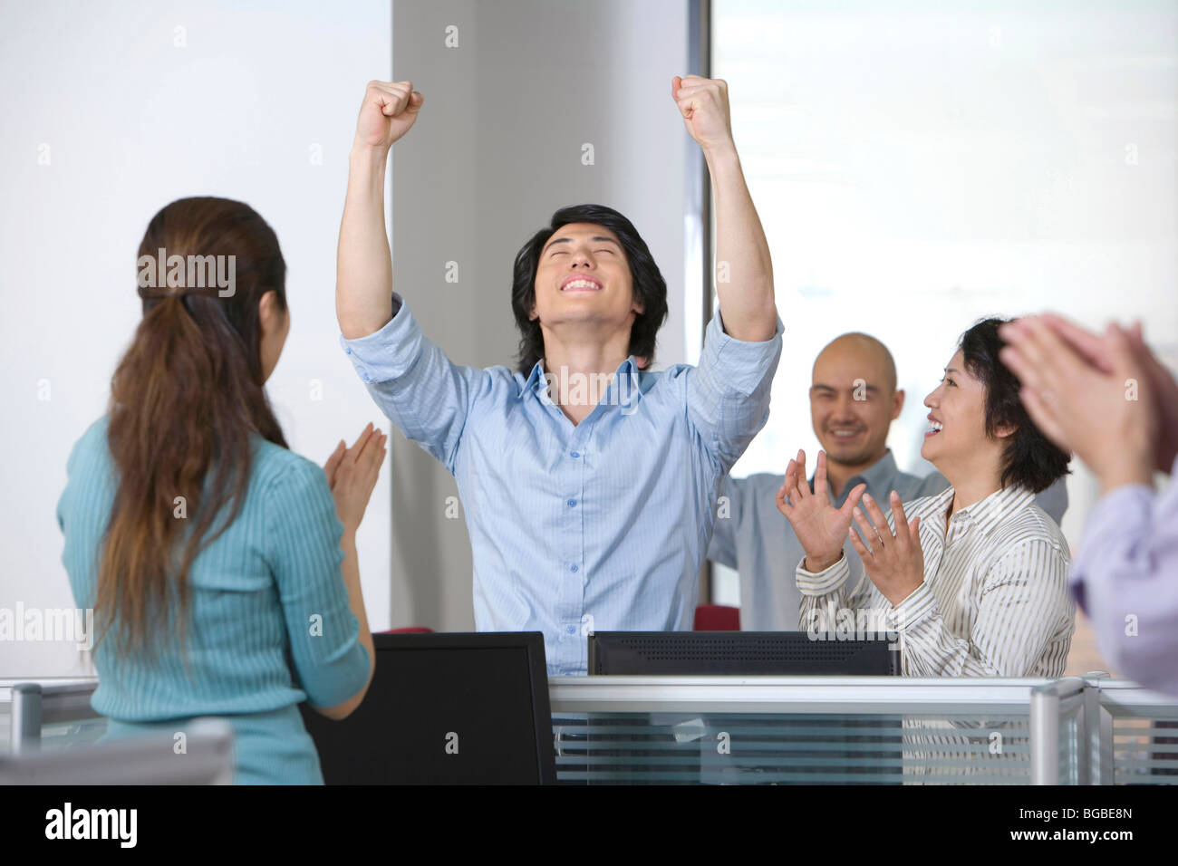 Office workers celebrate a success Stock Photo - Alamy