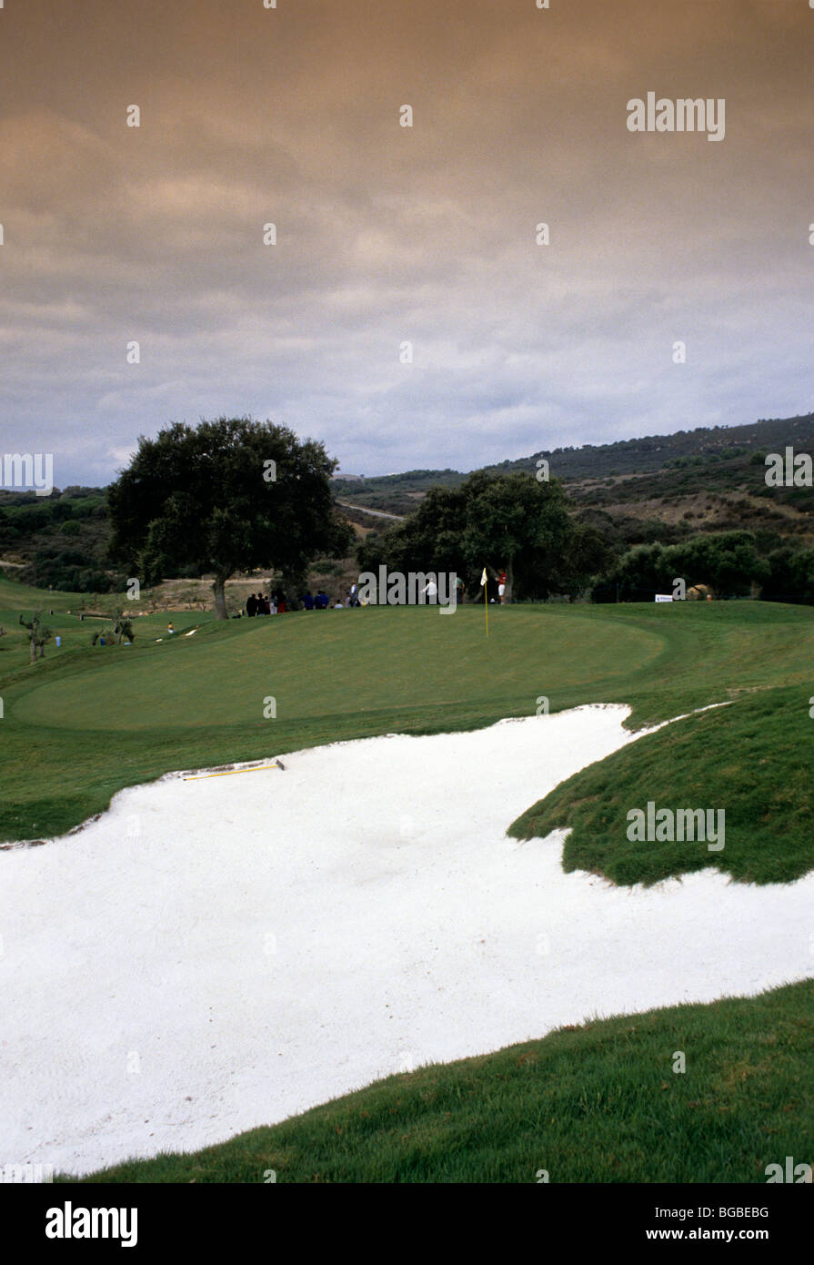 Golfers by a sand bunker on a golf course Stock Photo - Alamy