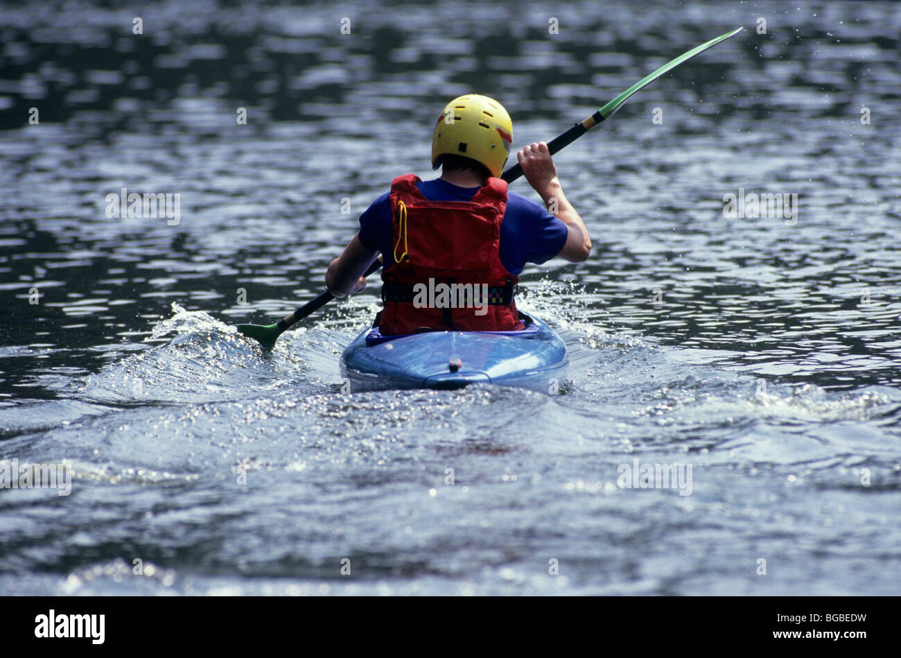Rear view of a man kayaking Stock Photo - Alamy