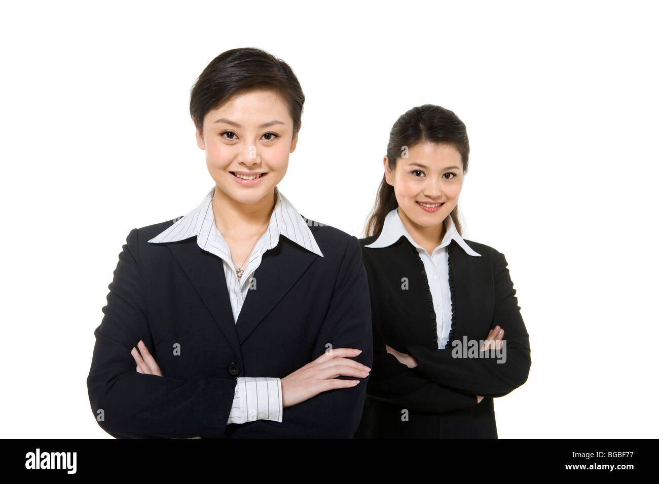 Two business professionals in dark suits on light background Stock ...