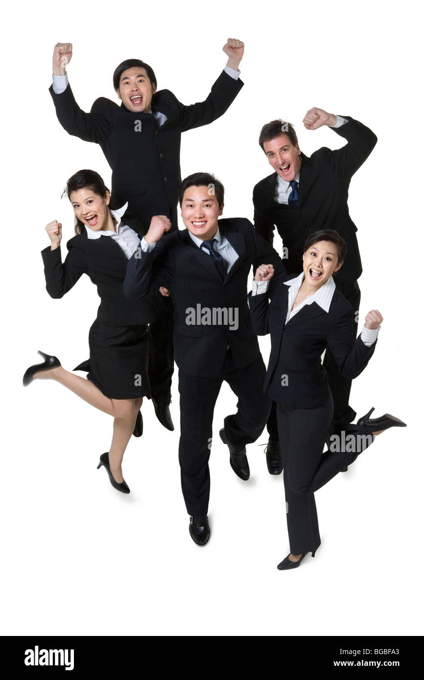 Excited business professionals on white background Stock Photo - Alamy