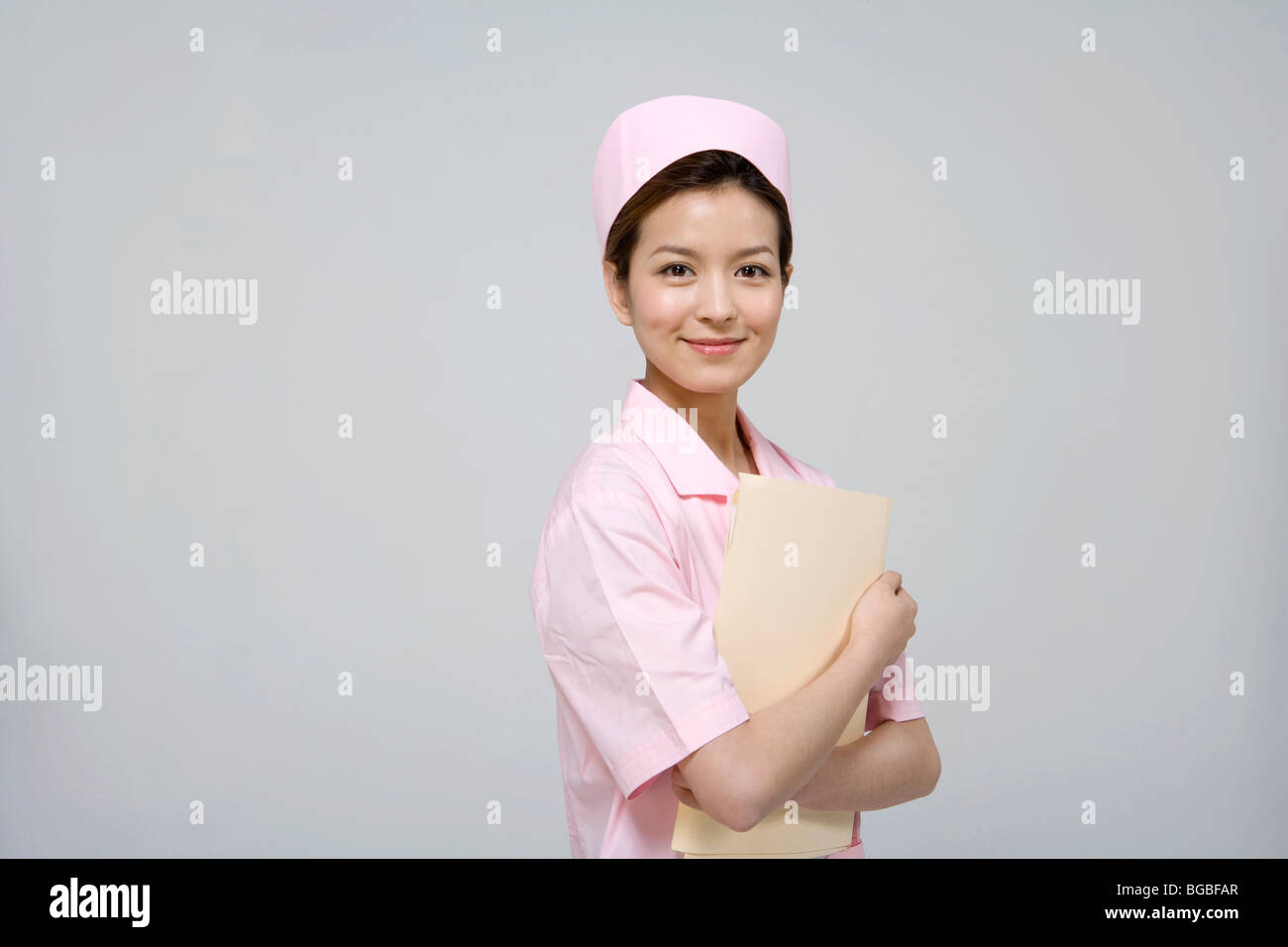 Nurse in pink uniform Stock Photo - Alamy