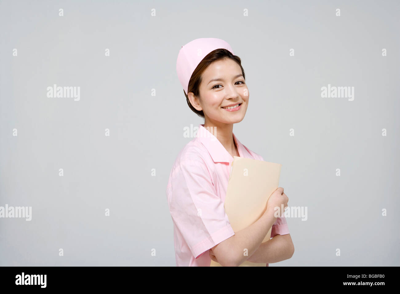 Nurse in pink uniform Stock Photo - Alamy