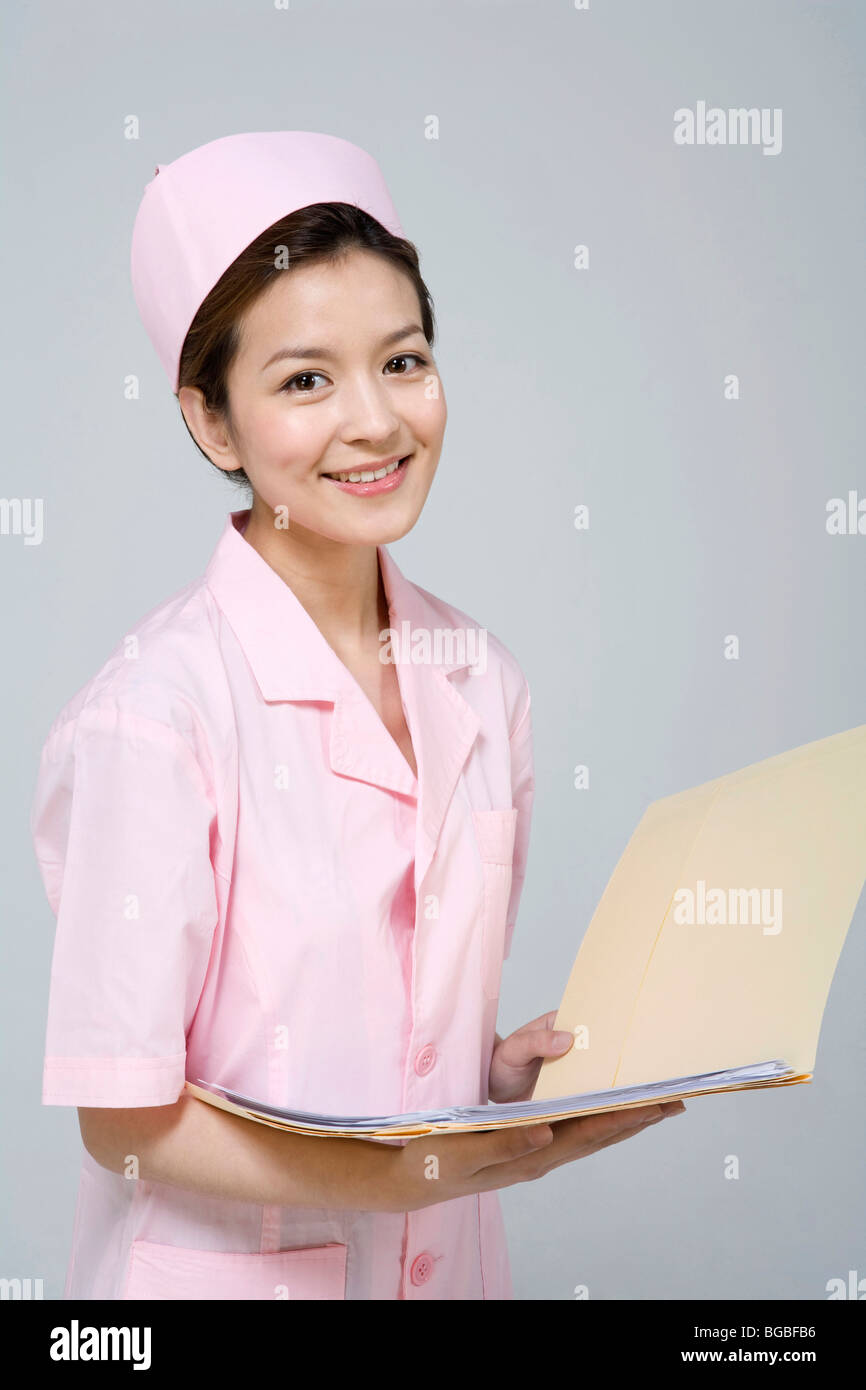 Nurse in pink uniform Stock Photo - Alamy