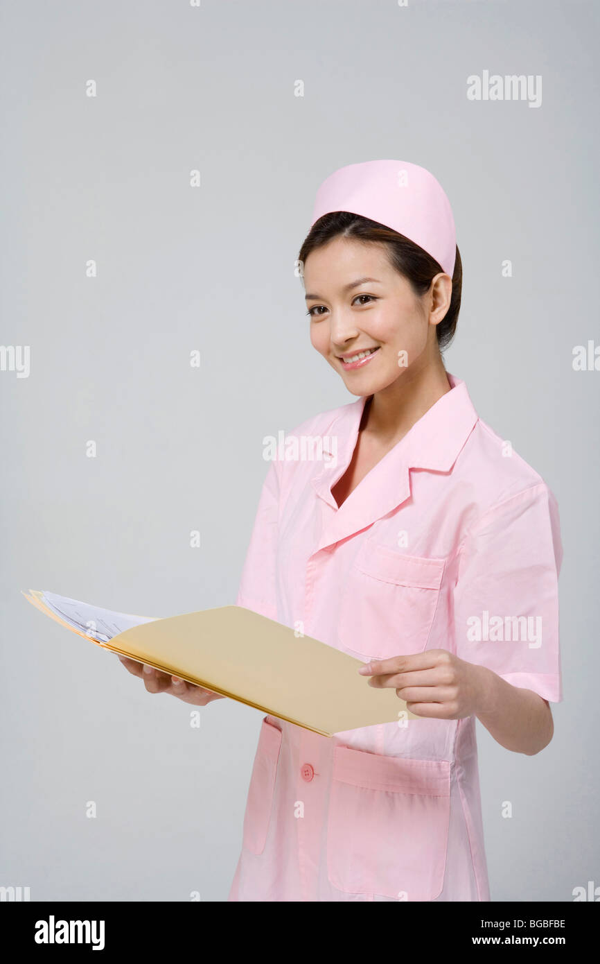 Nurse in pink uniform Stock Photo - Alamy