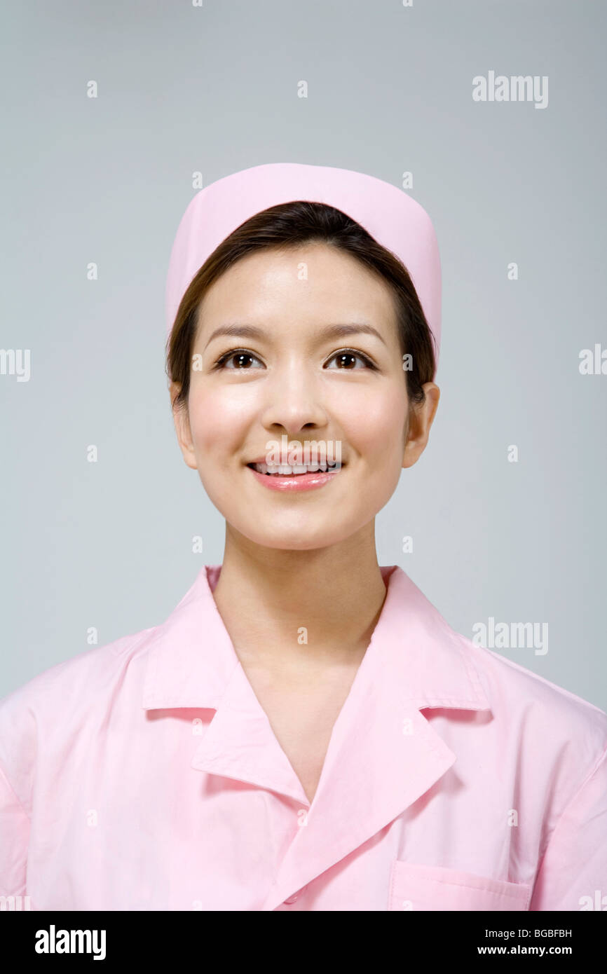 Nurse in pink uniform Stock Photo - Alamy