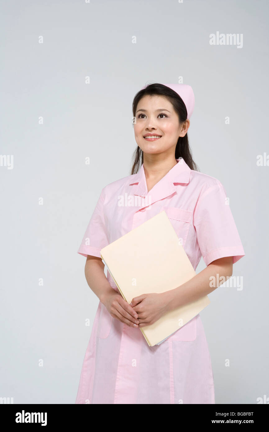 Nurse in pink uniform Stock Photo - Alamy