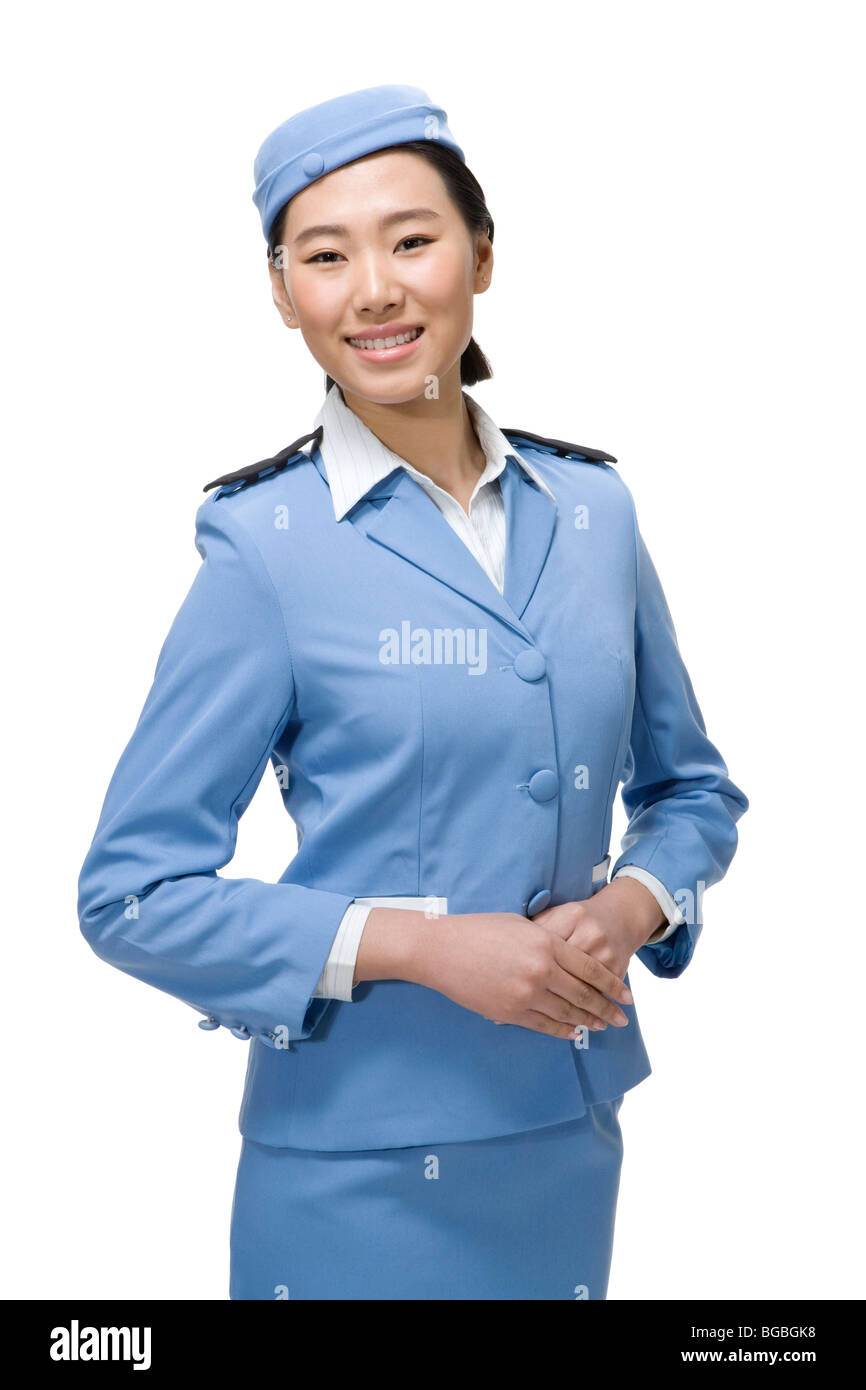 Smiling Flight Attendant Stock Photo - Alamy