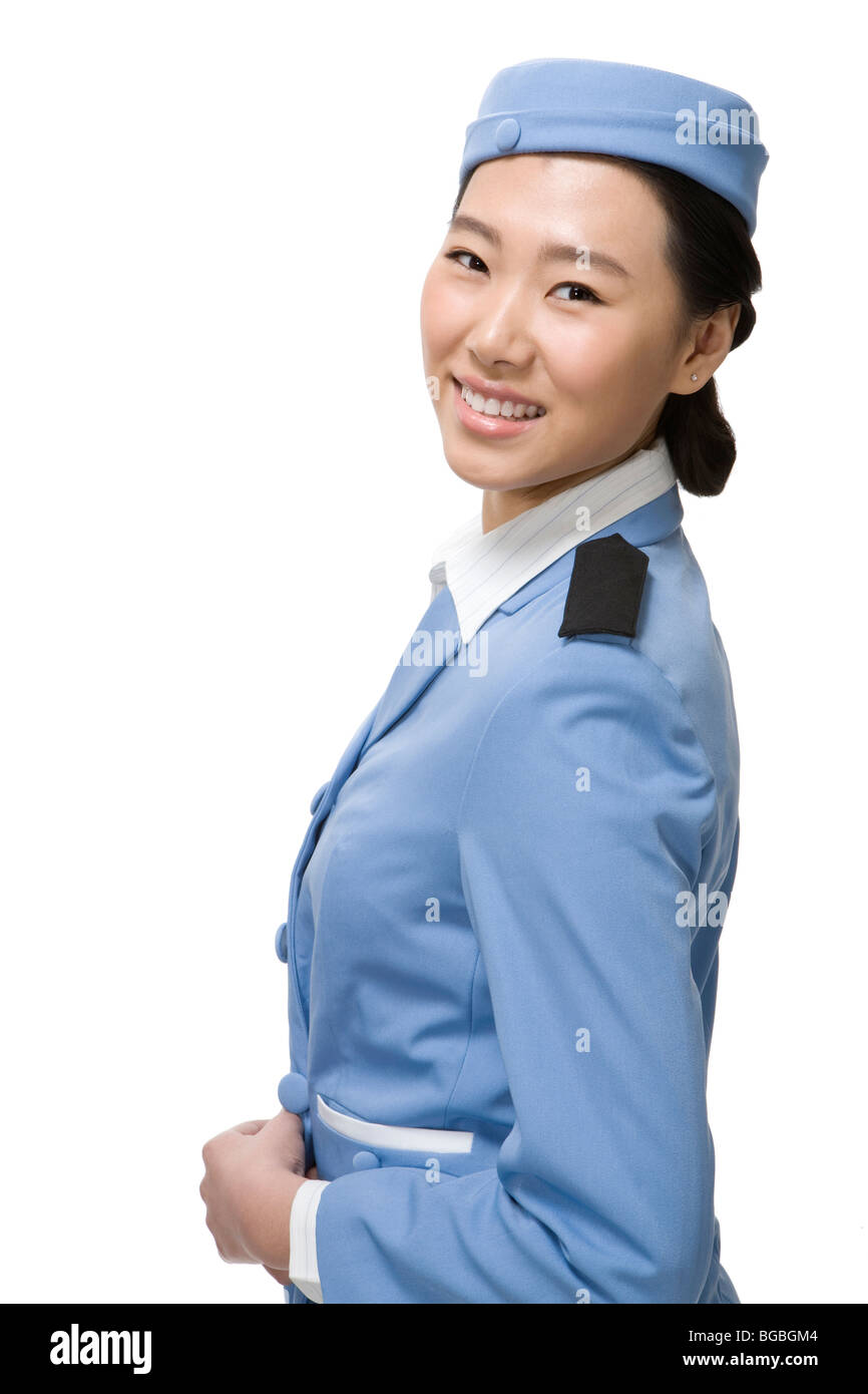 Smiling Flight Attendant Stock Photo - Alamy