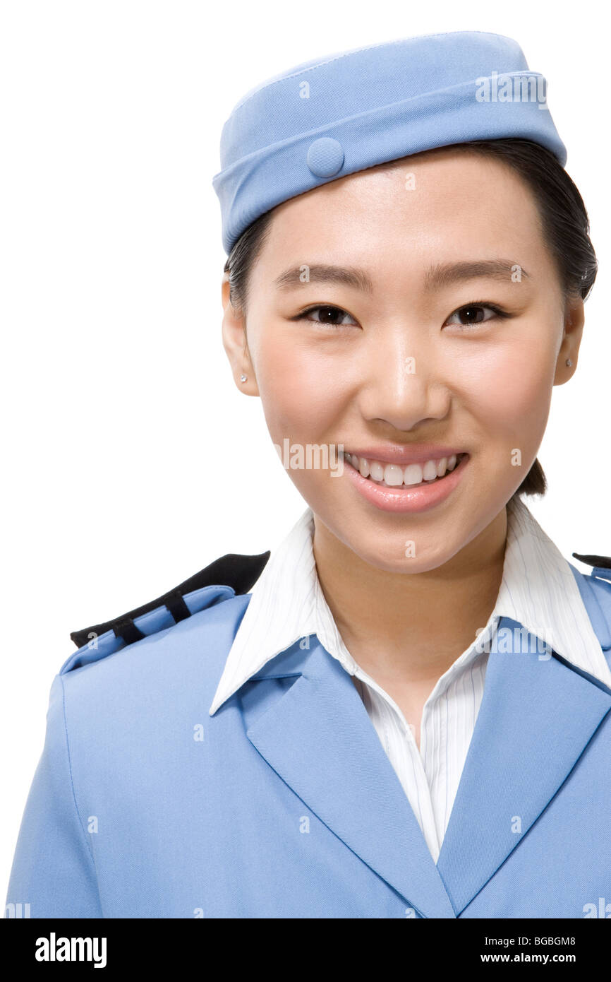 Smiling Flight Attendant Stock Photo - Alamy