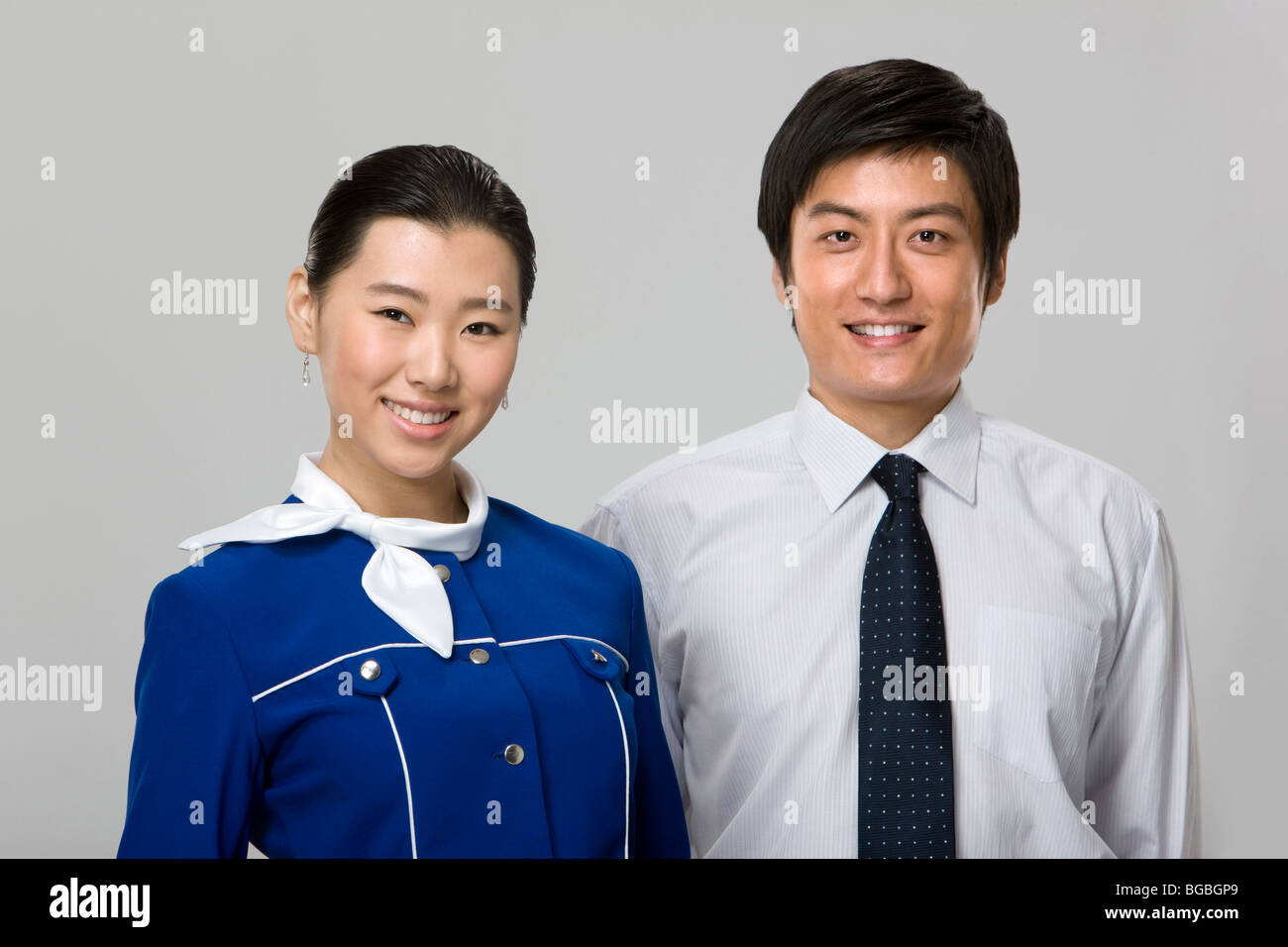 Smiling Flight Attendant Stock Photo - Alamy