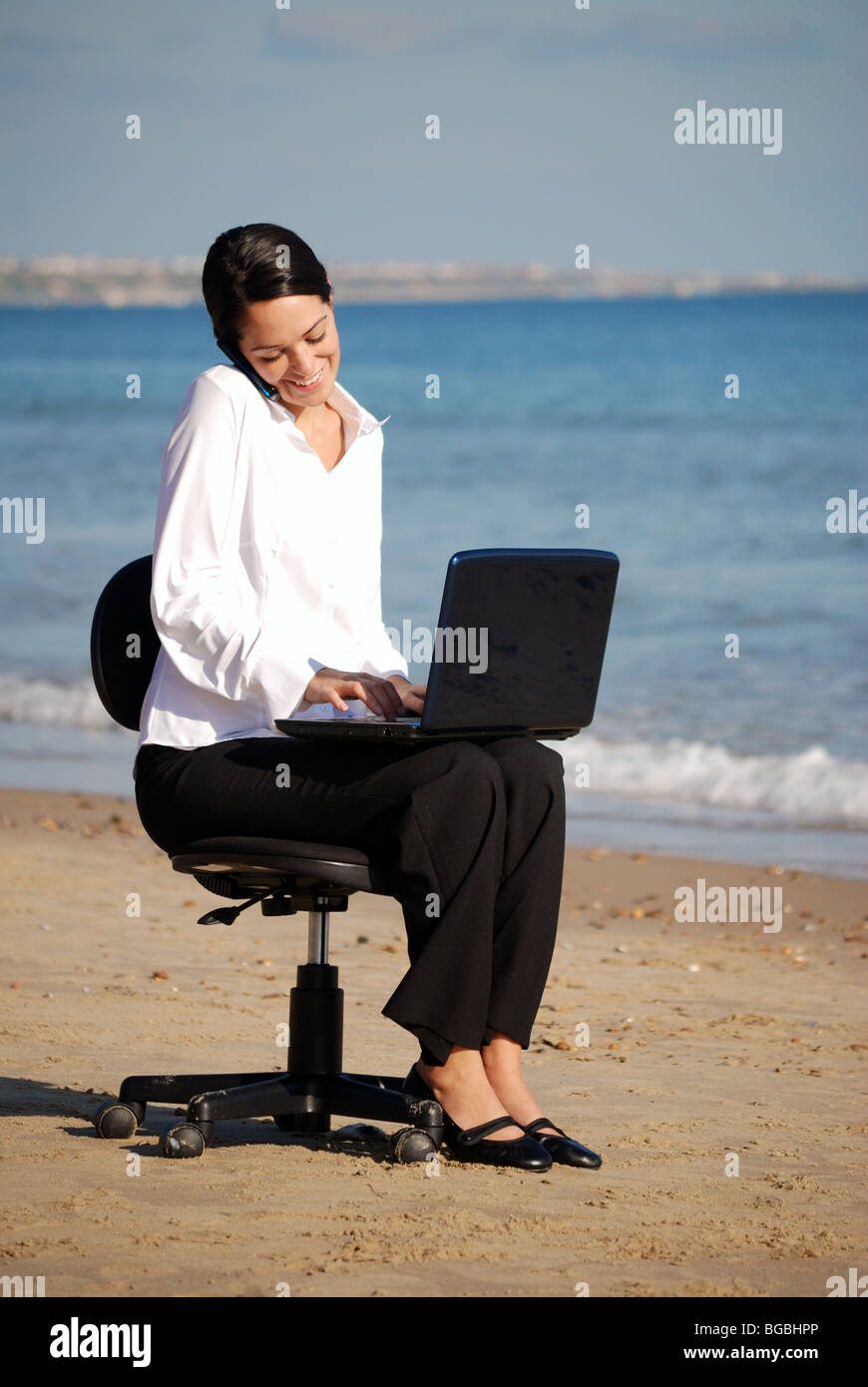 Office worker working on beach Stock Photo - Alamy