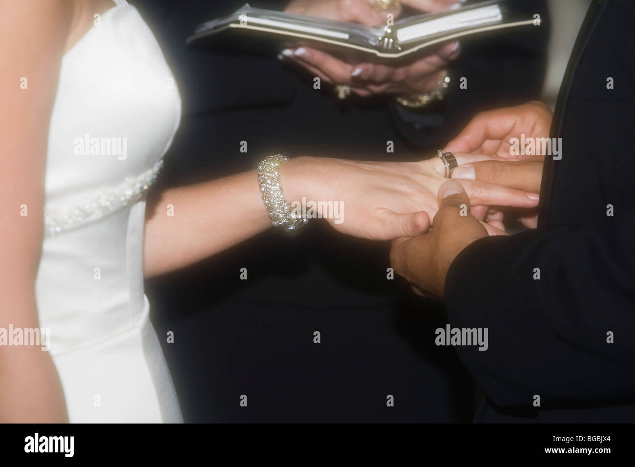 Bride bride groom exchanging rings hi-res stock photography and images ...