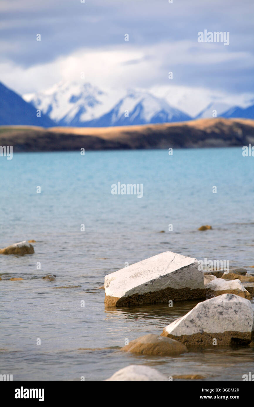 View across Lake Tekapo of distant mountains Stock Photo - Alamy