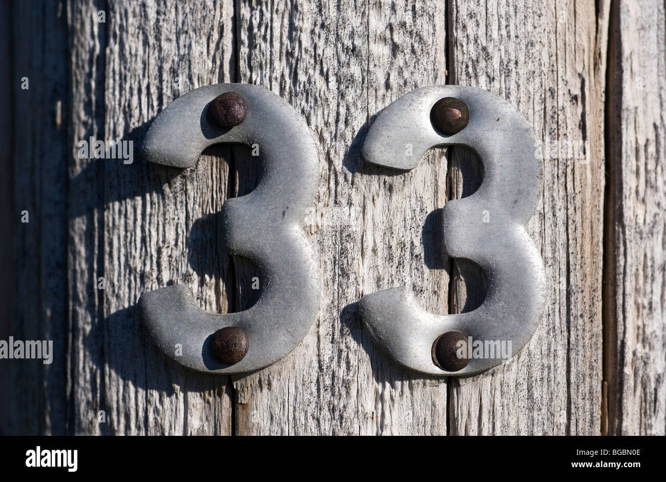 Metal number on a telephone pole Stock Photo - Alamy