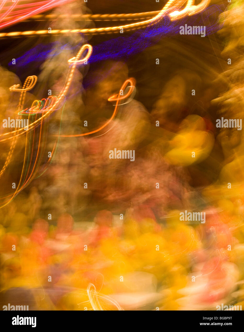 abstract orange yellow moving light pattern of fairground ride Stock ...