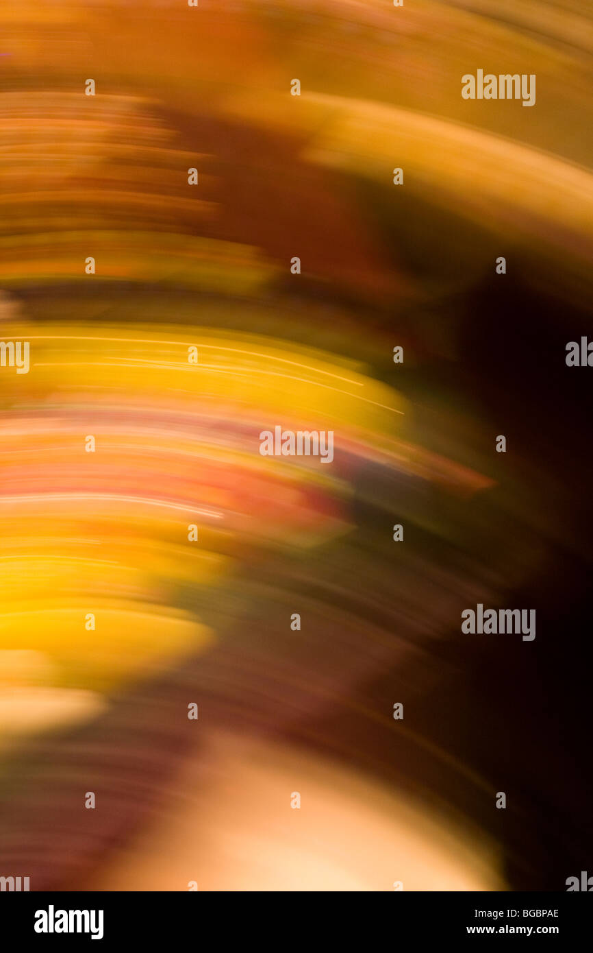 abstract orange yellow moving light pattern of fairground ride Stock ...