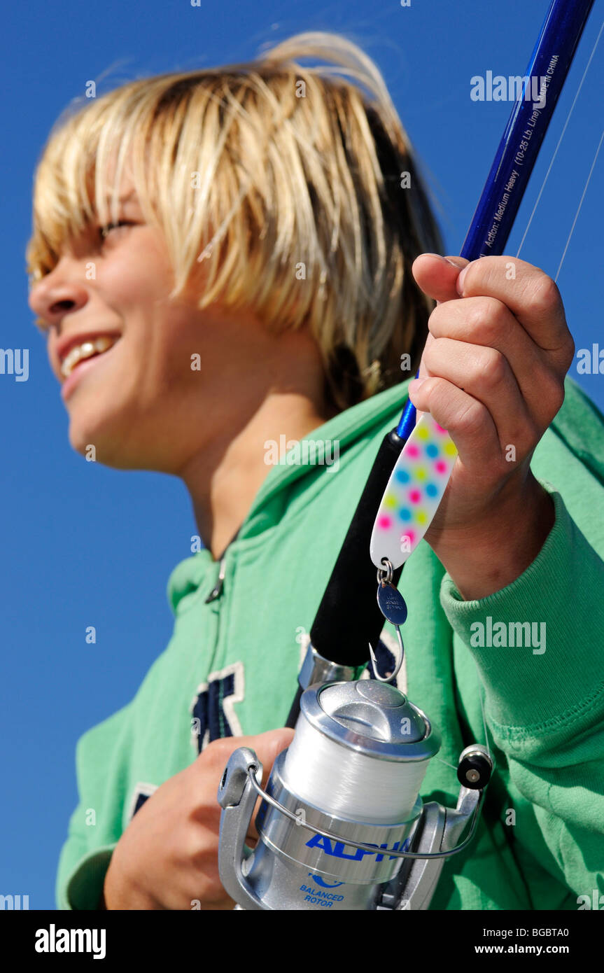 Boy with fishing rod Stock Photo - Alamy